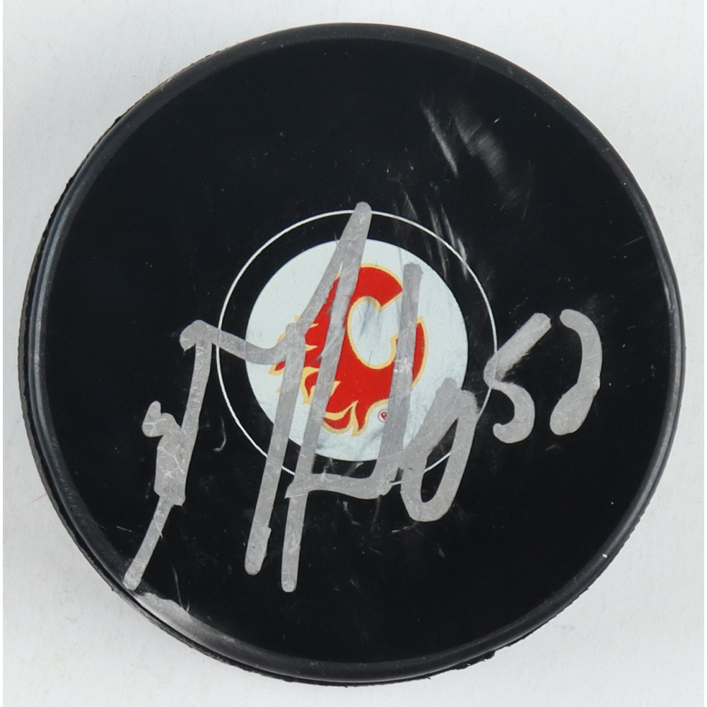 MacKenzie Weegar Signed Flames Logo Puck (Beckett) | Pristine Auction