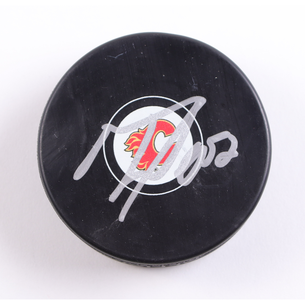 MacKenzie Weegar Signed Flames Logo Puck (Beckett) | Pristine Auction