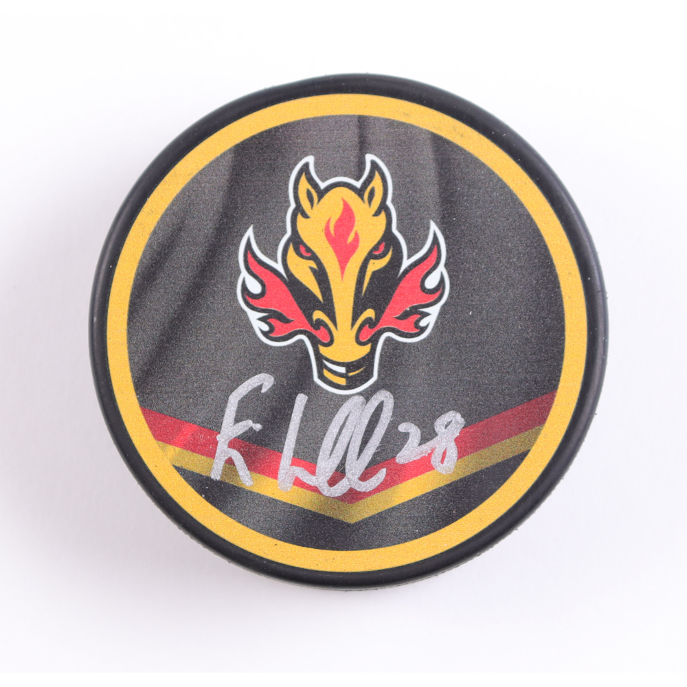 Elias Lindholm Signed Flames Logo Hockey Puck (Beckett) | Pristine Auction